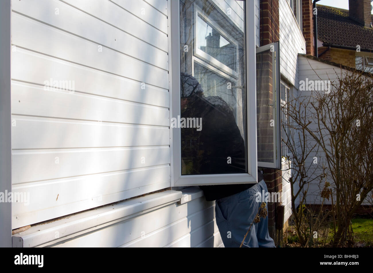 Climbing through window hi-res stock photography and images - Alamy