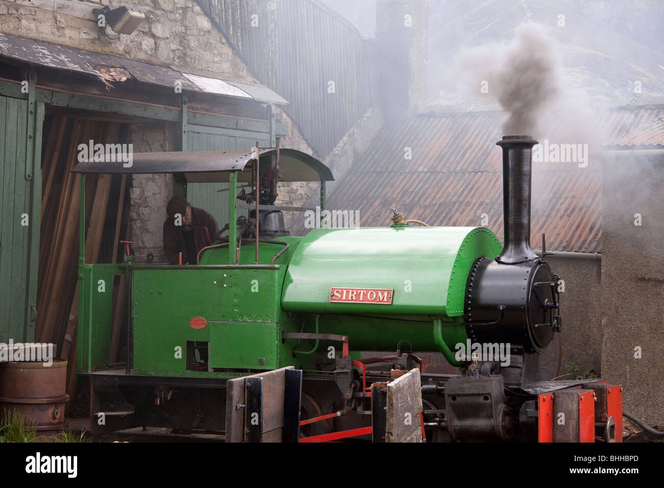 Man starting old locomotive Stock Photo - Alamy