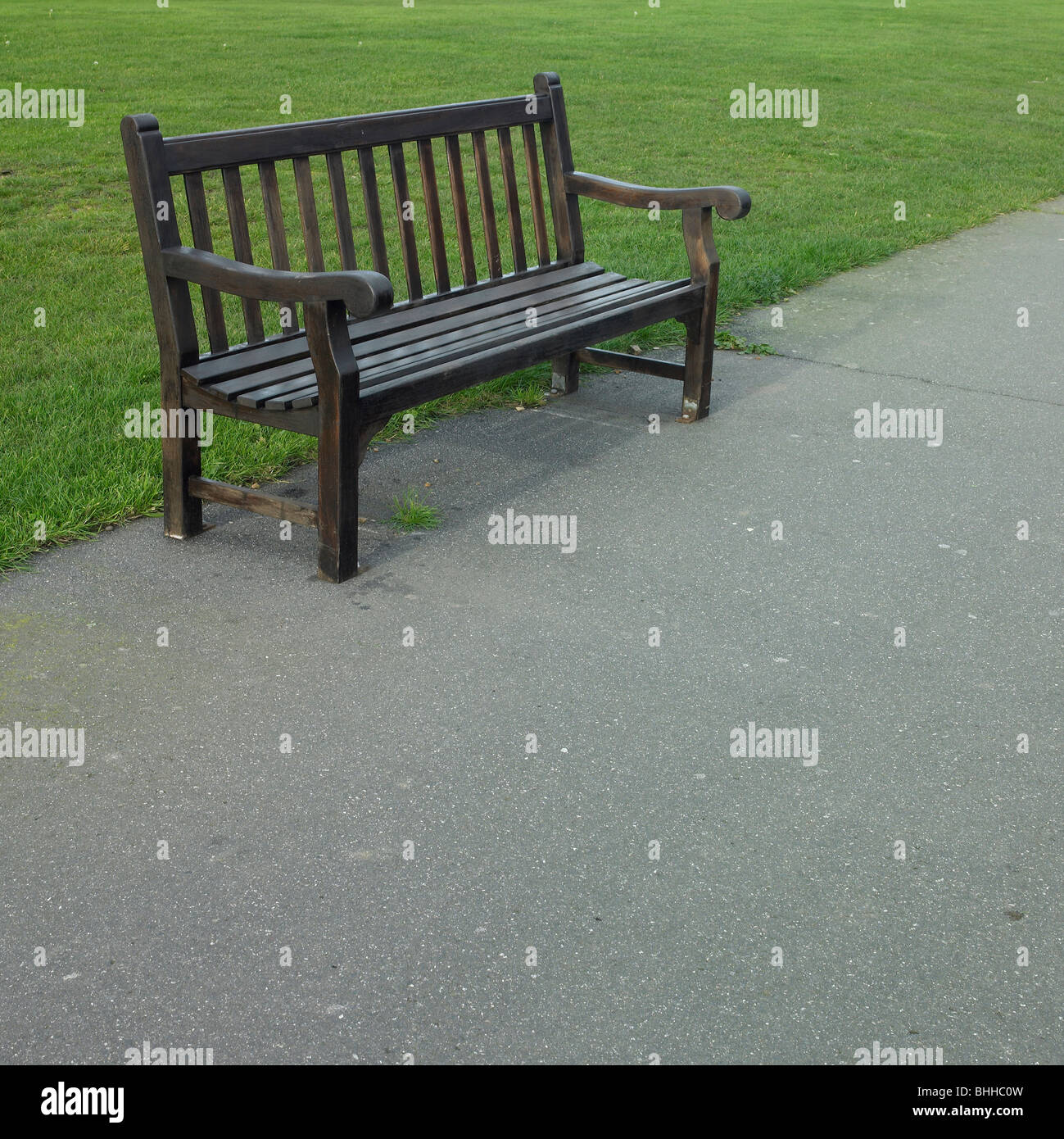 park bench on a path Stock Photo - Alamy