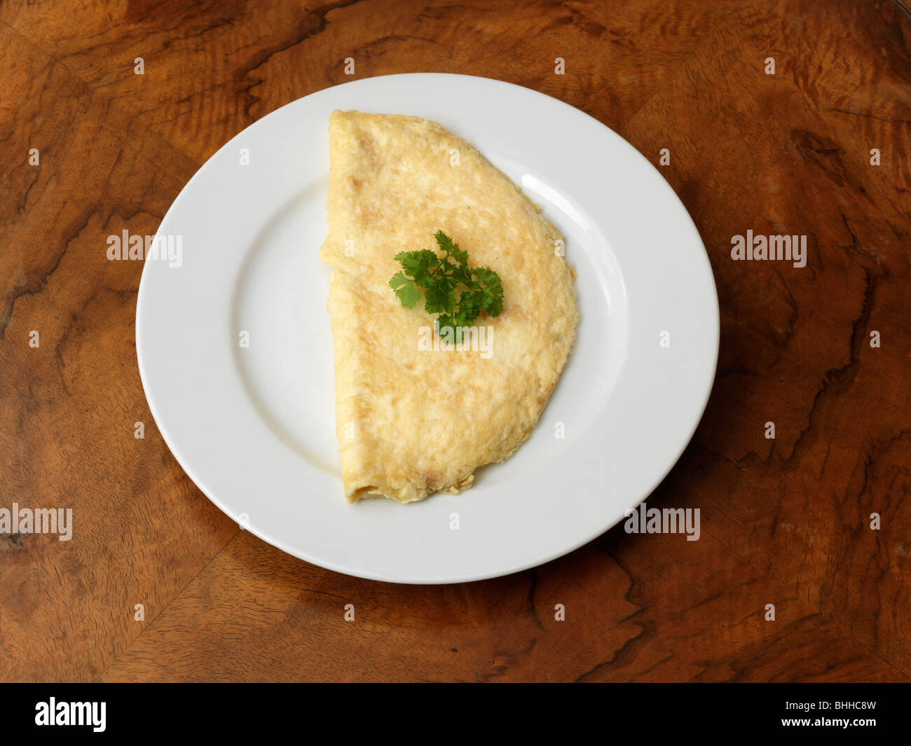 A Plate with Omelette and a bit of Garnish Stock Photo - Alamy