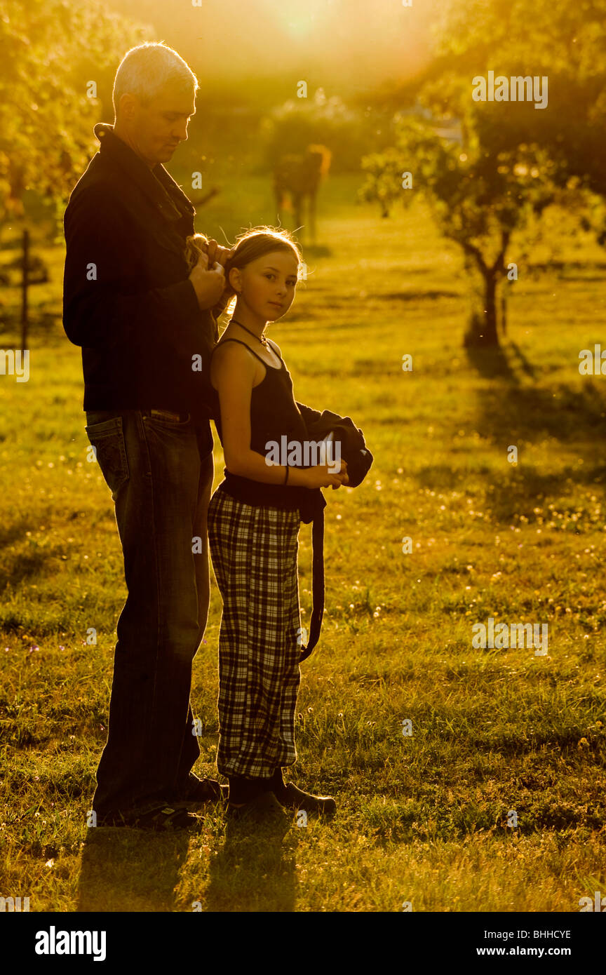 Father and daughter in an enclosed pasture, Sweden Stock Photo - Alamy