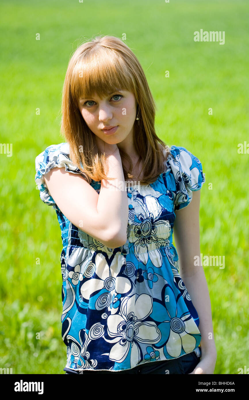 Pretty young lady outdoors in a wheat field Stock Photo - Alamy