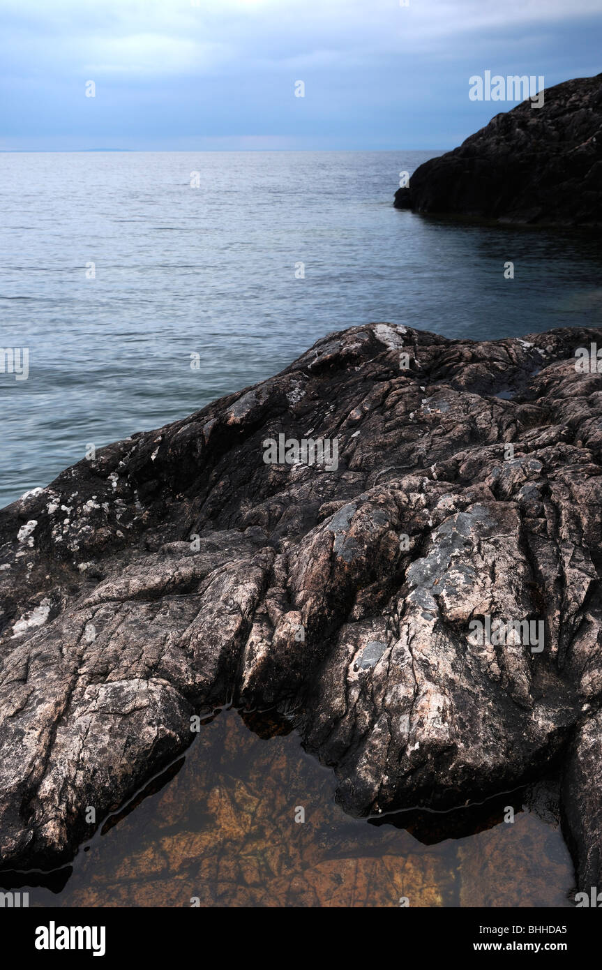 Rocks by a lake, Sweden Stock Photo - Alamy