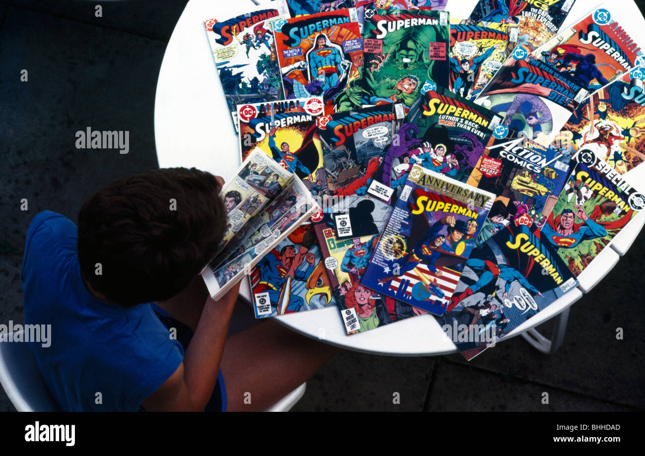 Boy With Collection Of Superman Comics Stock Photo - Alamy