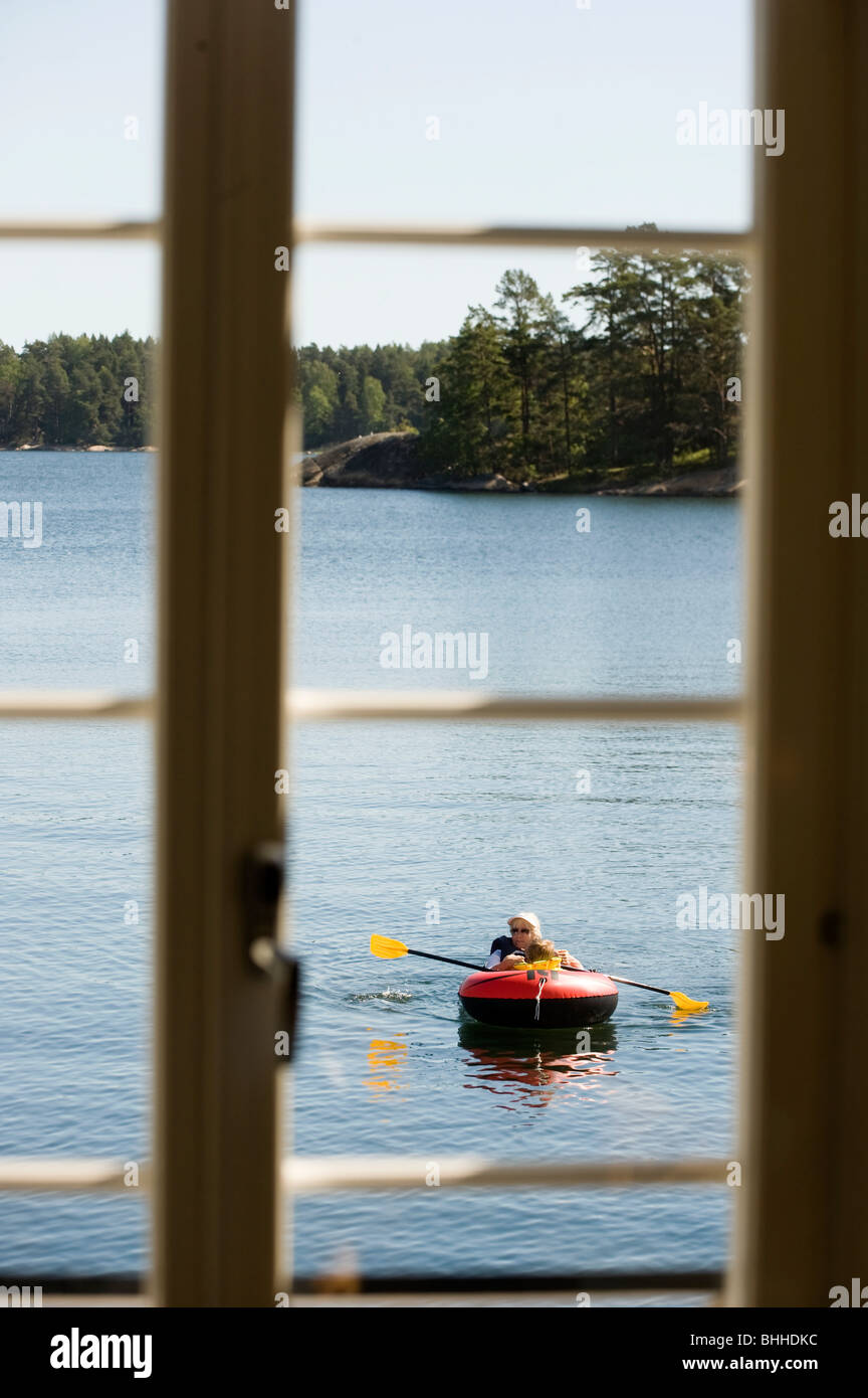 A woman in a rowing-boat, Stockholm archipelago, Sweden Stock Photo - Alamy