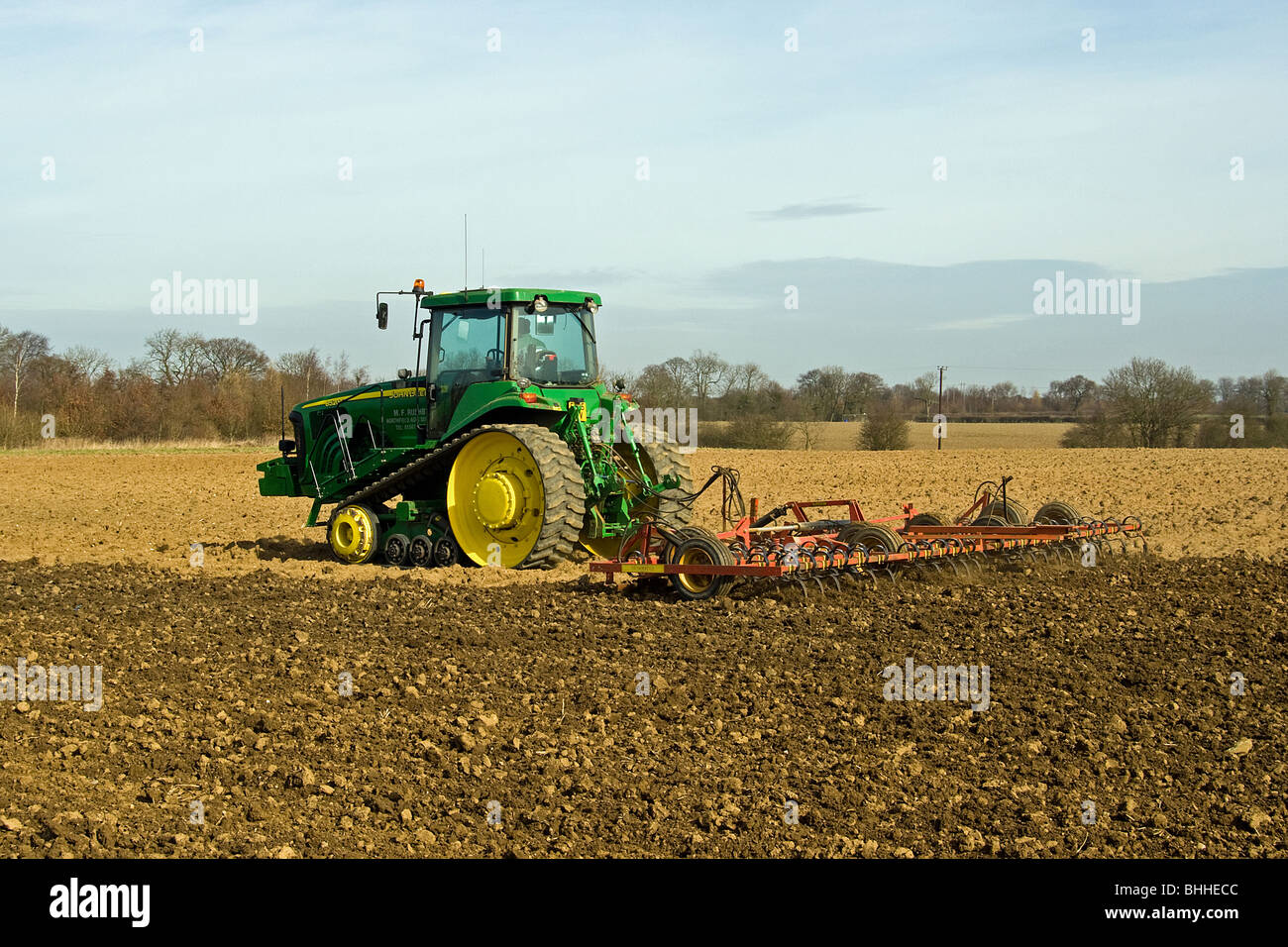 Farming in Lincolnshire - John Deer track tractor pulling soil ...