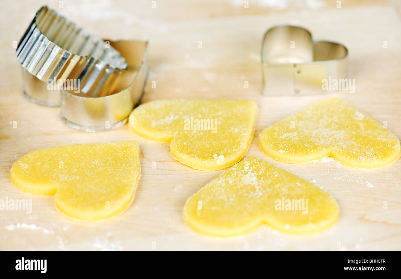 Making heart shaped shortbread cookies with cutters Stock Photo - Alamy
