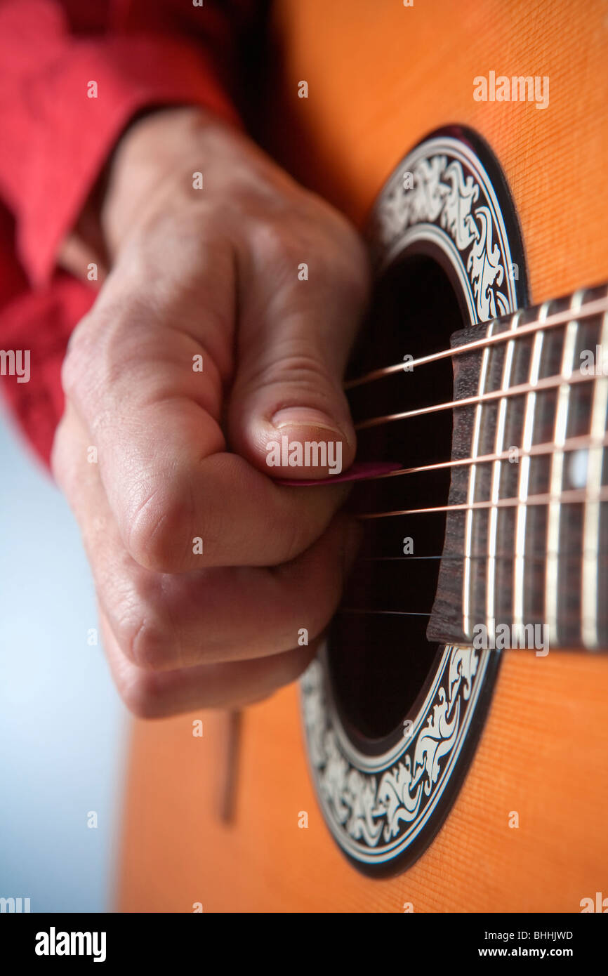 closeup of hands of a musician playing acoustic guitar Stock Photo - Alamy