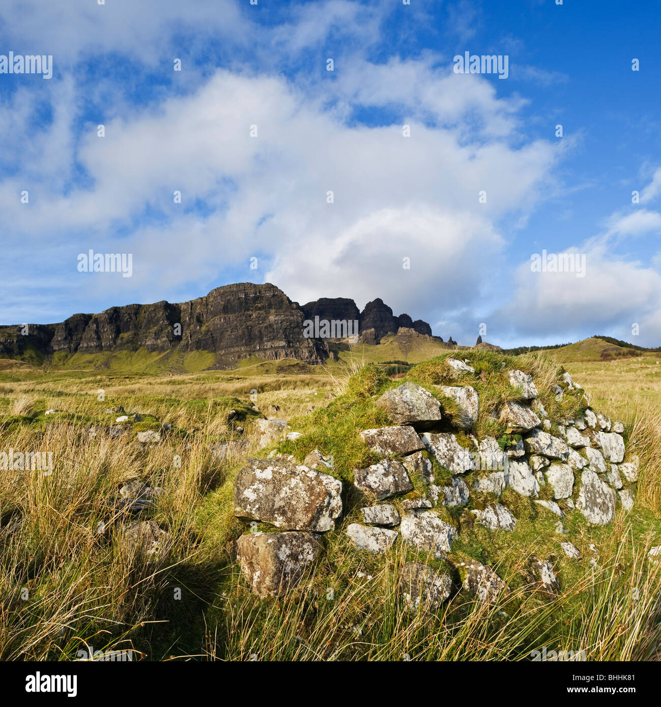 Crumbling stone wall of old croft building with the Storr in distance ...