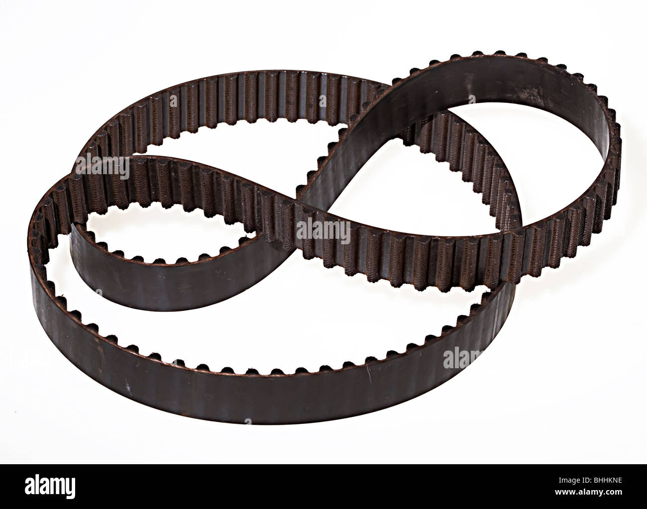 Used worn engine cam belt Stock Photo - Alamy