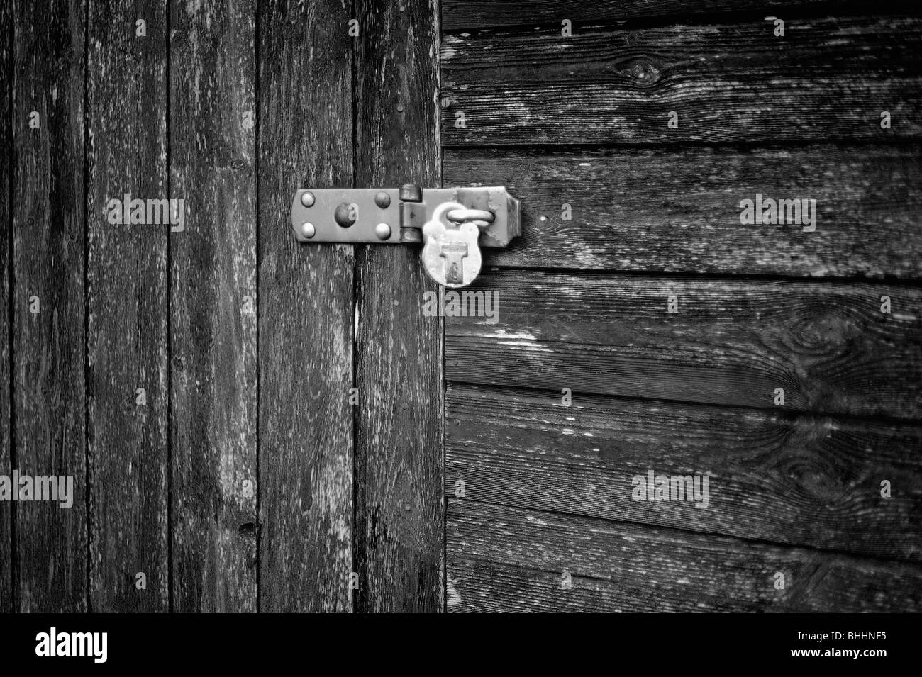 Padlock on gate close Black and White Stock Photos & Images - Alamy