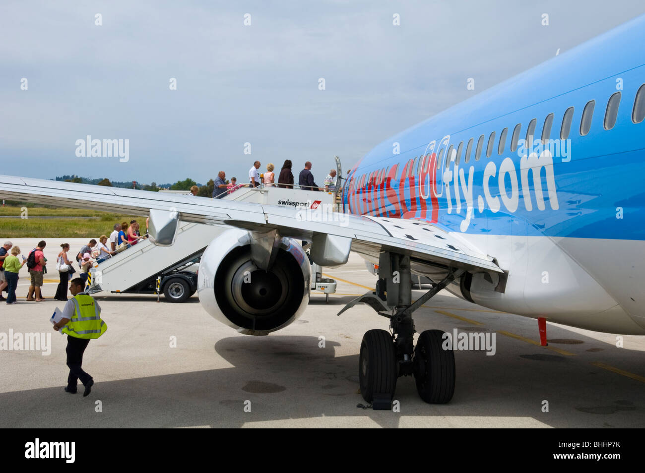 Passengers boarding aircraft at airport on the Greek Mediterranean ...