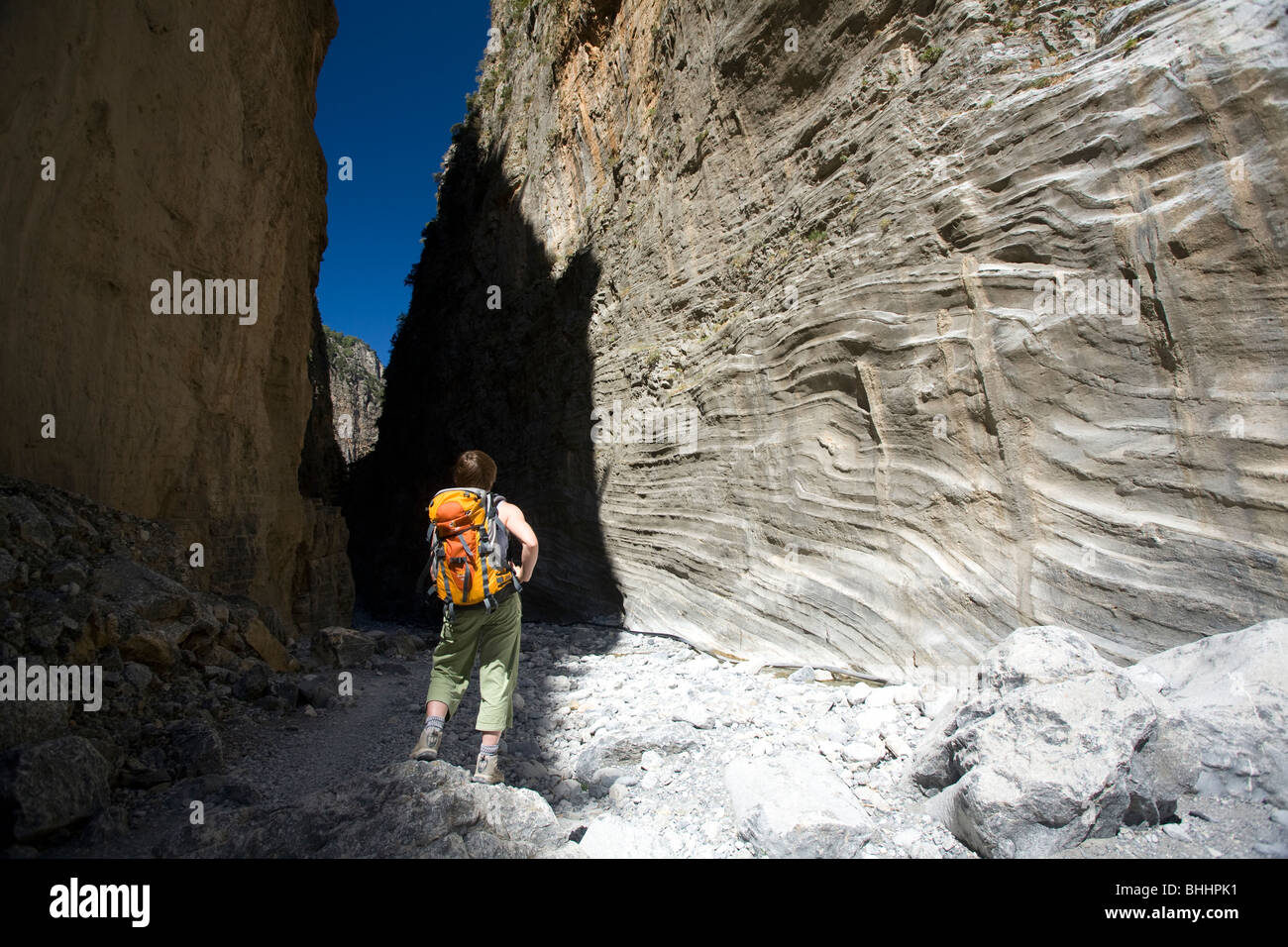 Hiker beside the Iron Gates, Samaria Gorge, Samaria National Park ...