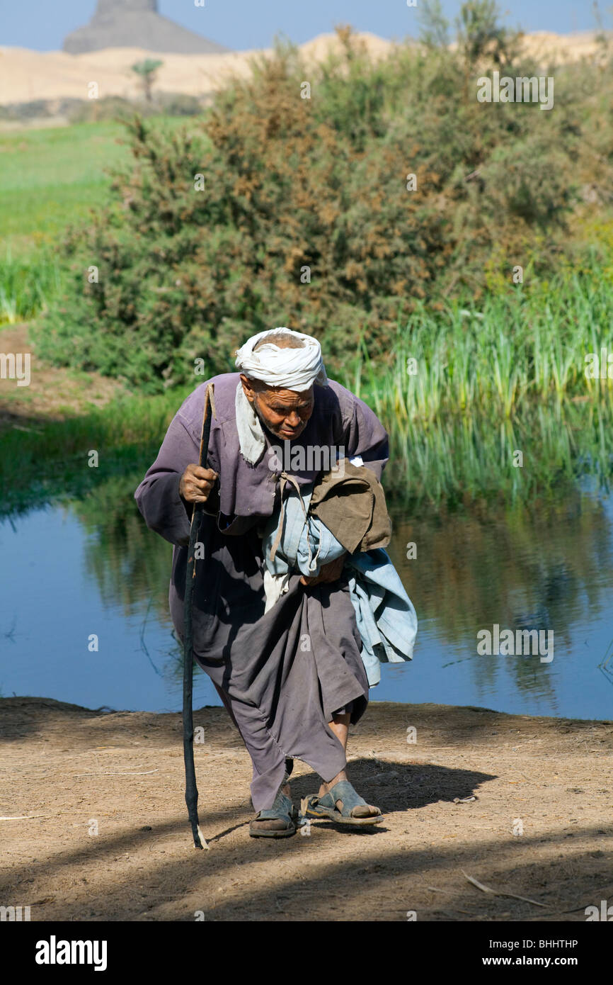 Old man walking bent hi-res stock photography and images - Alamy