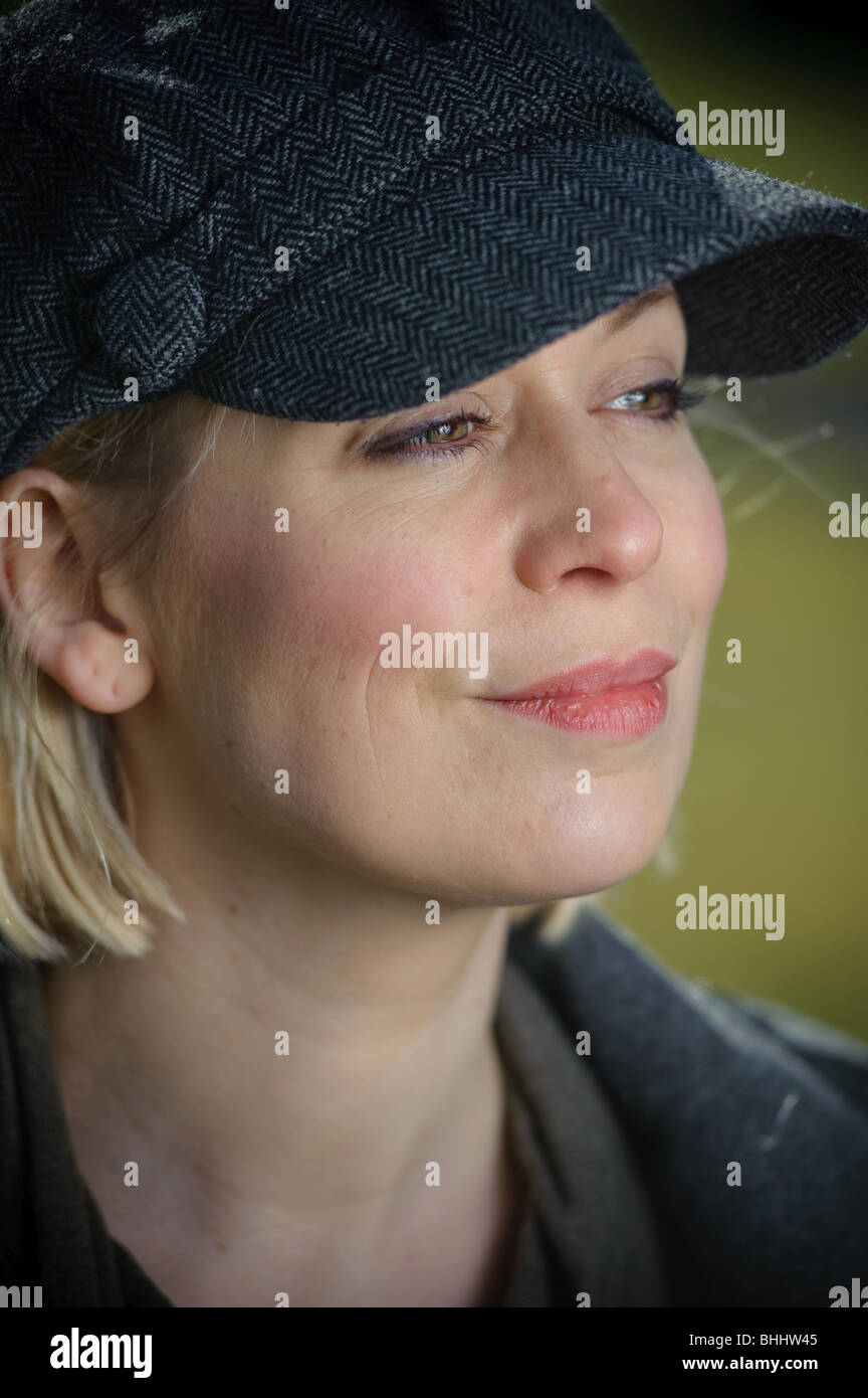 Blond woman in cap outdoor portrait Stock Photo - Alamy