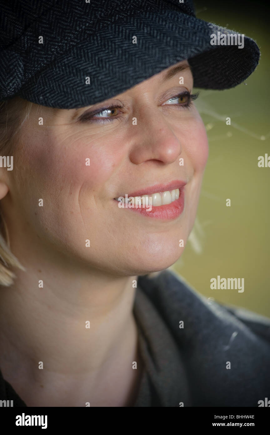 Blond woman in cap outdoor portrait Stock Photo - Alamy
