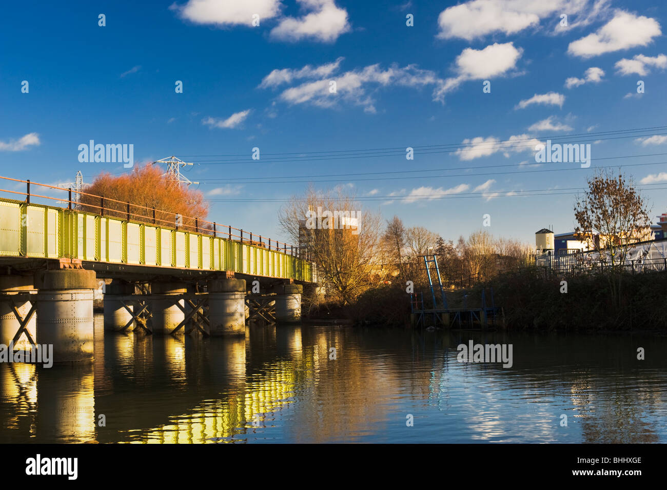 Green railway bridge over the RIver Nene in central Peterborough ...