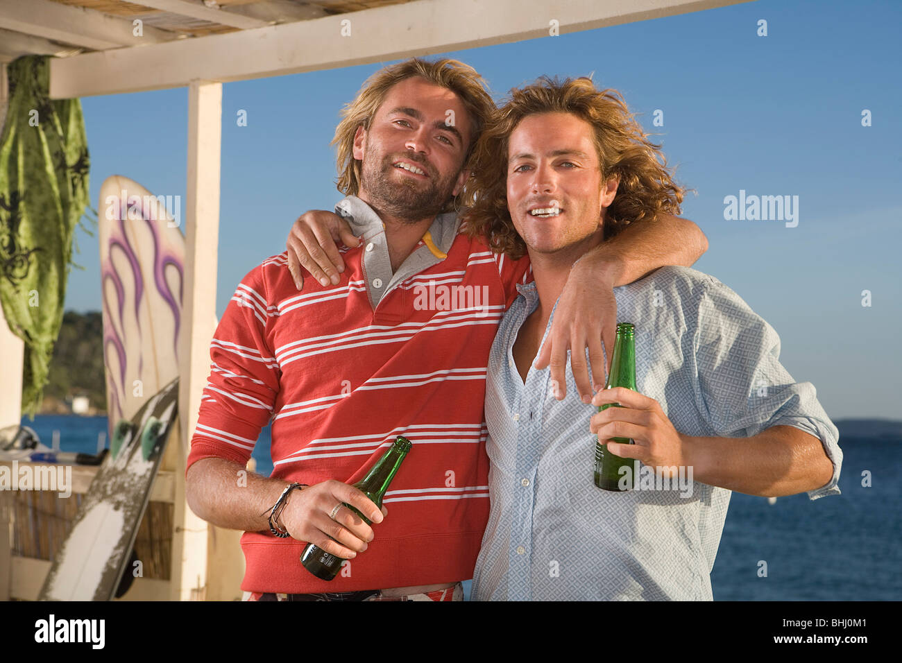 surf men drinking beer Stock Photo - Alamy