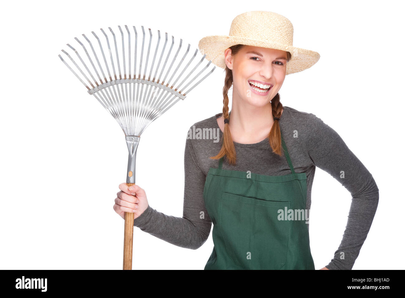 Full isolated studio picture from a young and beautiful gardener with ...