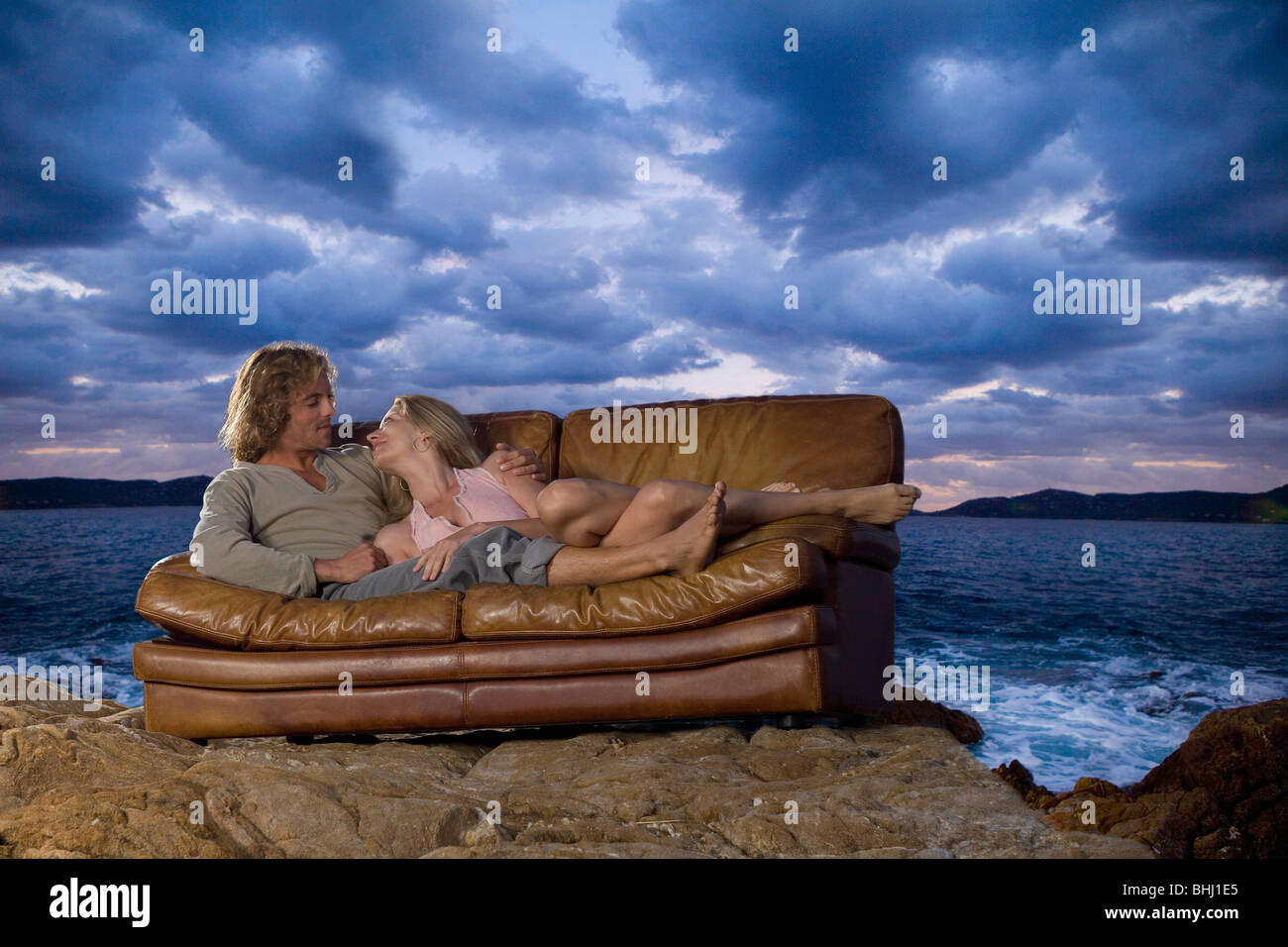 Mature couple laying on couch hi-res stock photography and images - Alamy