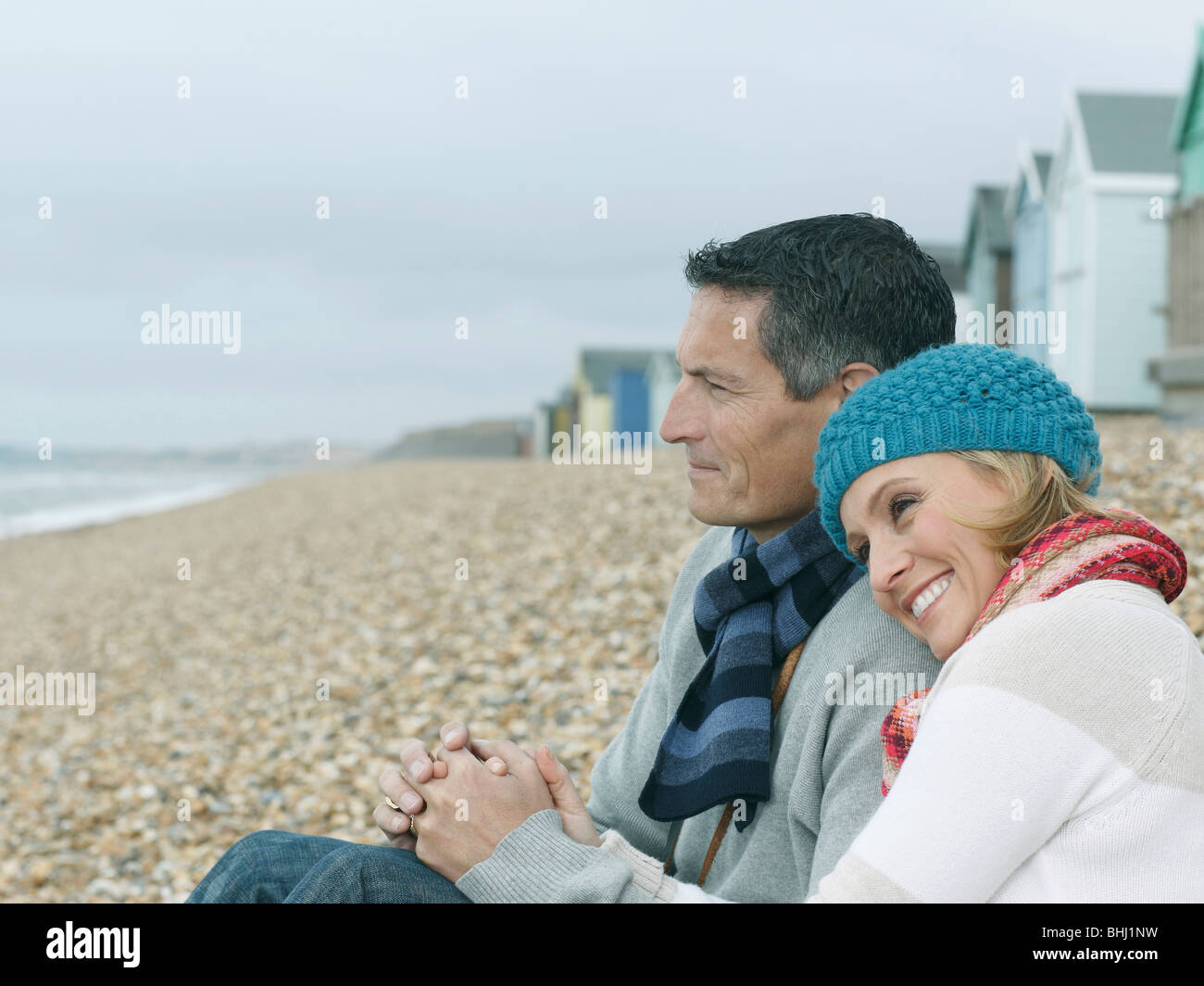 Two people huddled together hi-res stock photography and images - Alamy