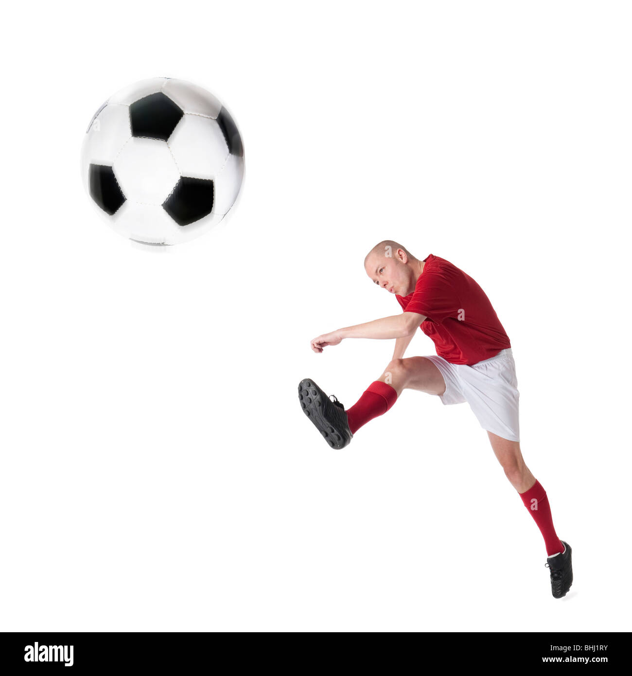 Full isolated studio picture from a young soccer player with ball Stock ...