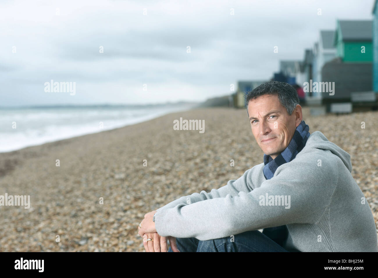 Man with on Beach looking at camera Stock Photo - Alamy