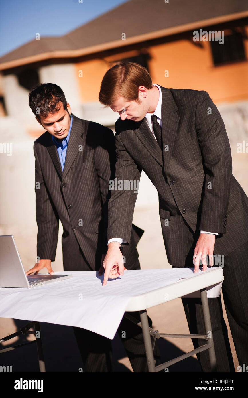 Two men reviewing plans hi-res stock photography and images - Alamy