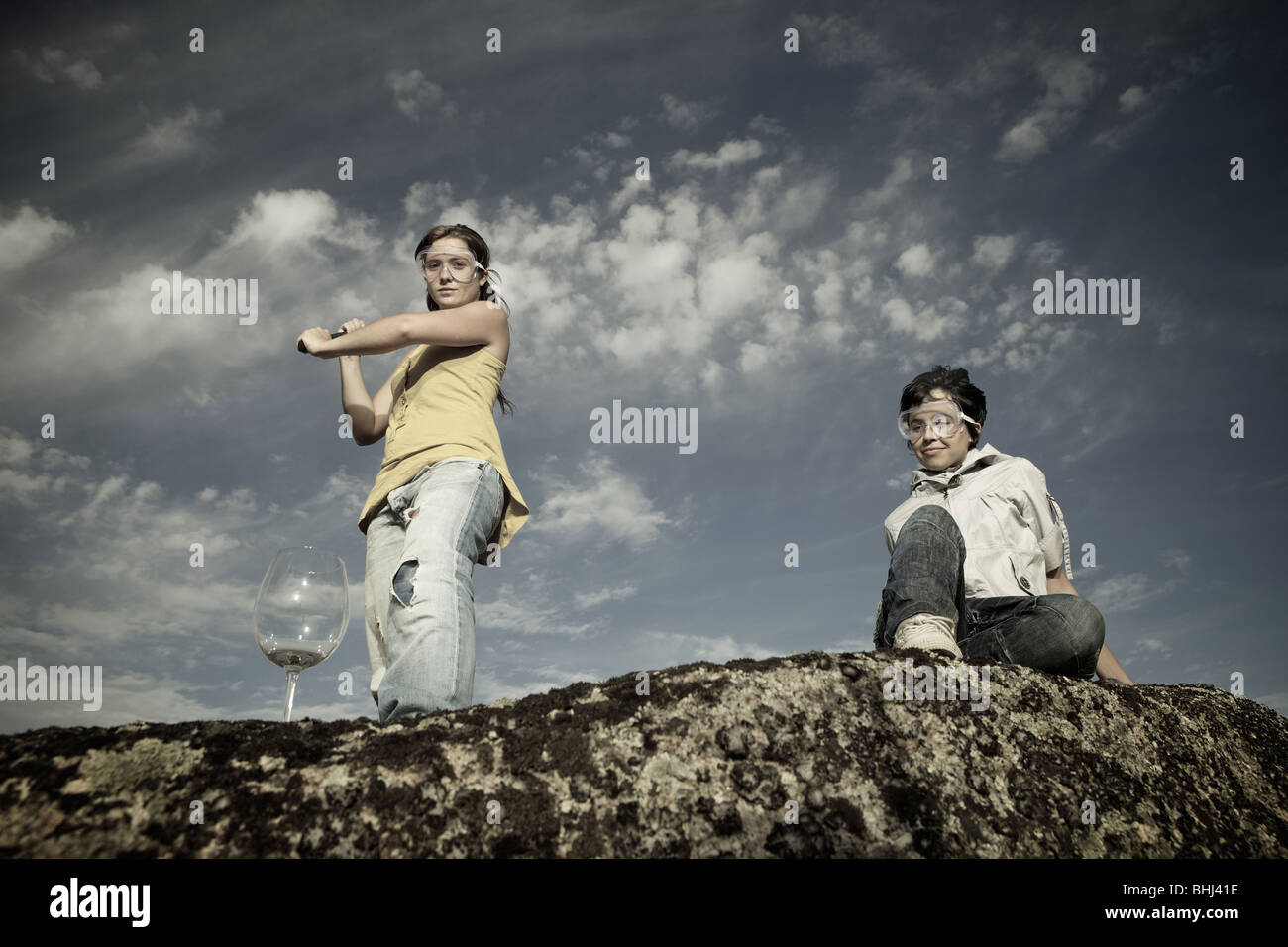 two girls on a rock Stock Photo - Alamy