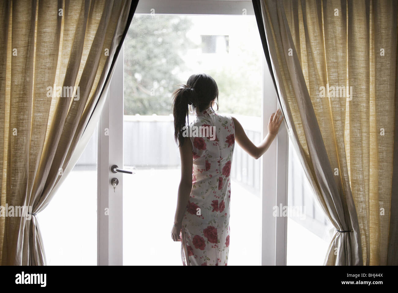 girl behind a window Stock Photo - Alamy