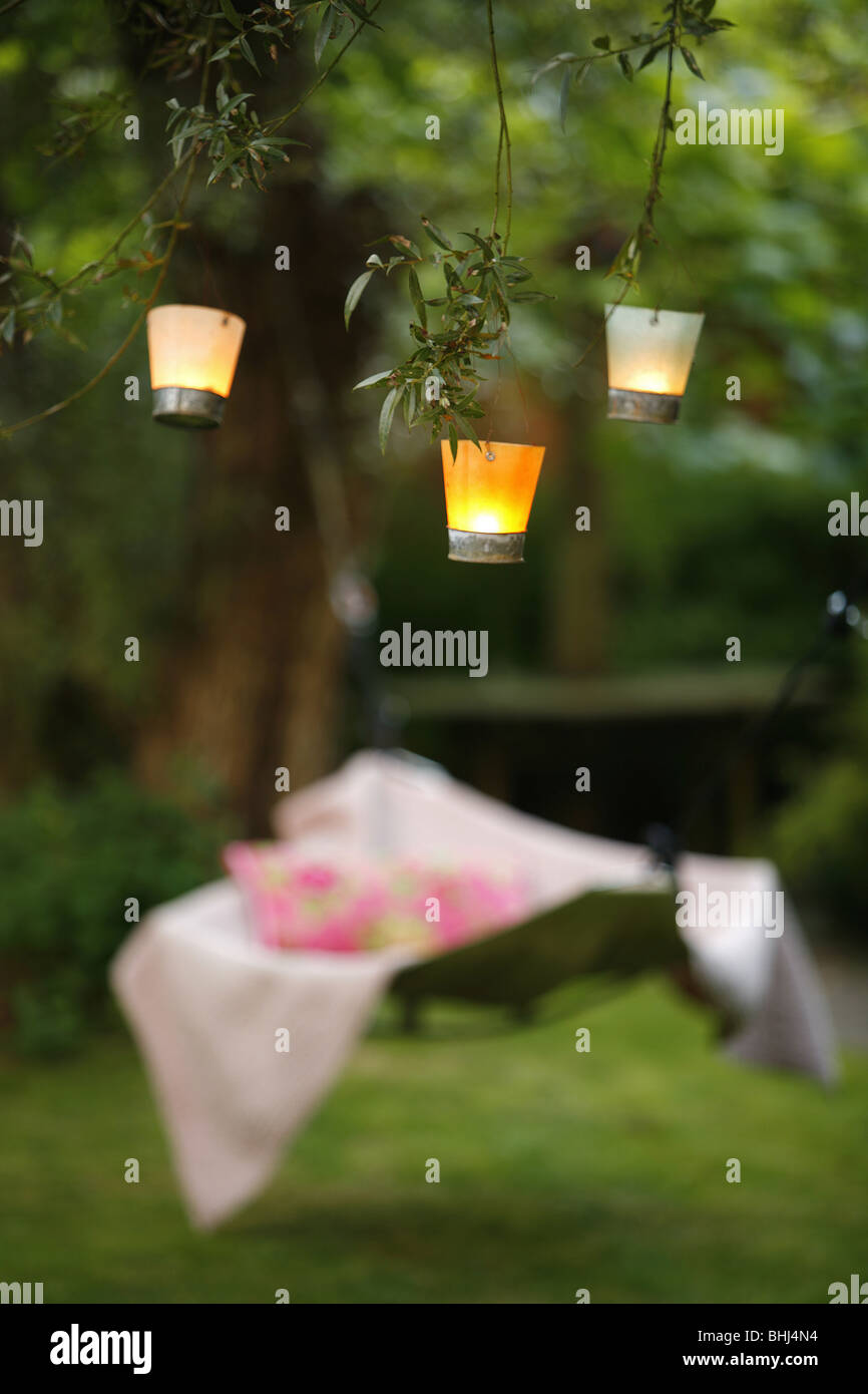 Candles hanging from branches Stock Photo - Alamy