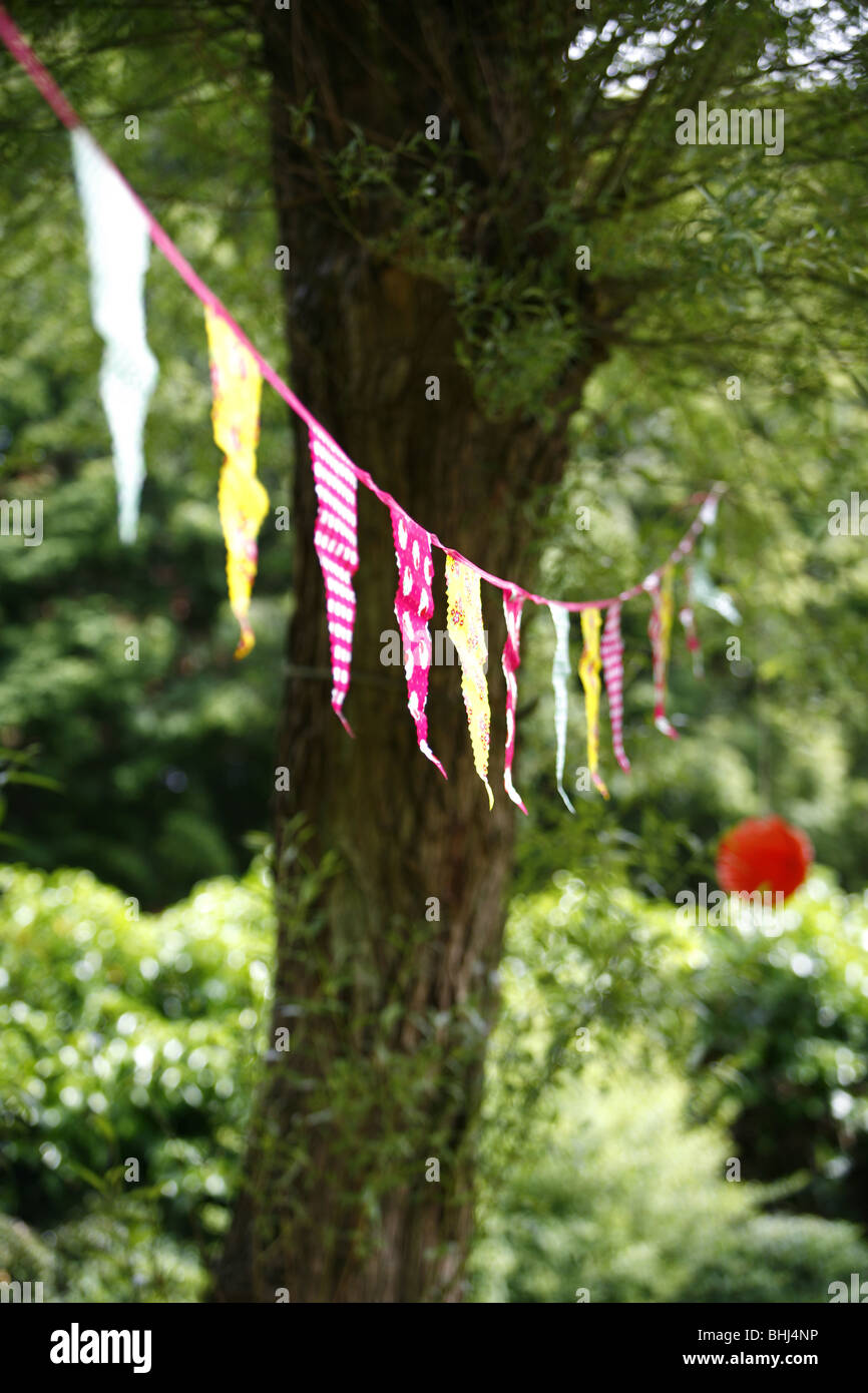 Flags hanging from a tree Stock Photo - Alamy