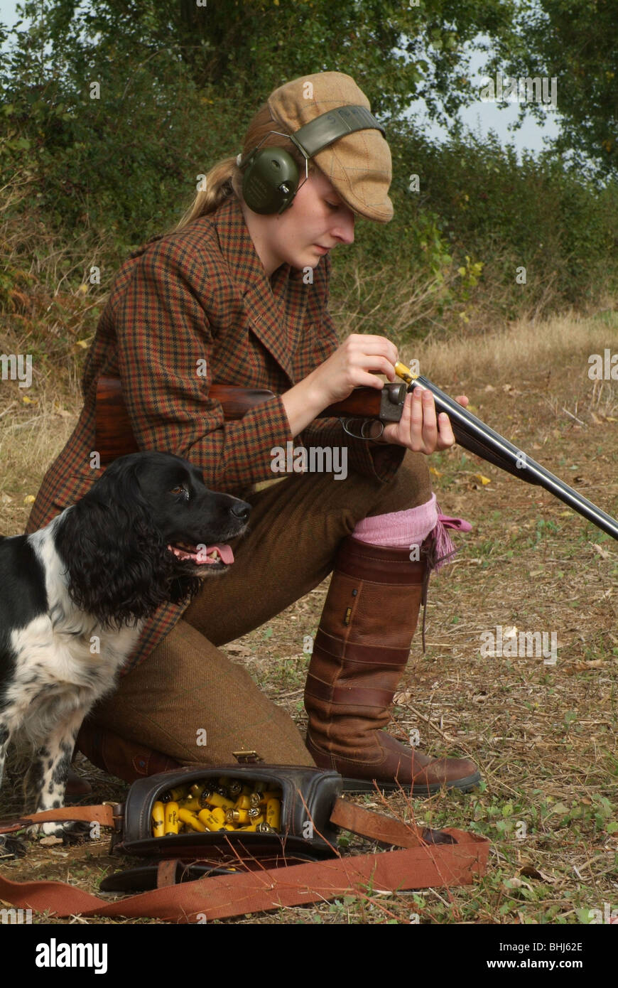 A woman loading a gun Stock Photo - Alamy