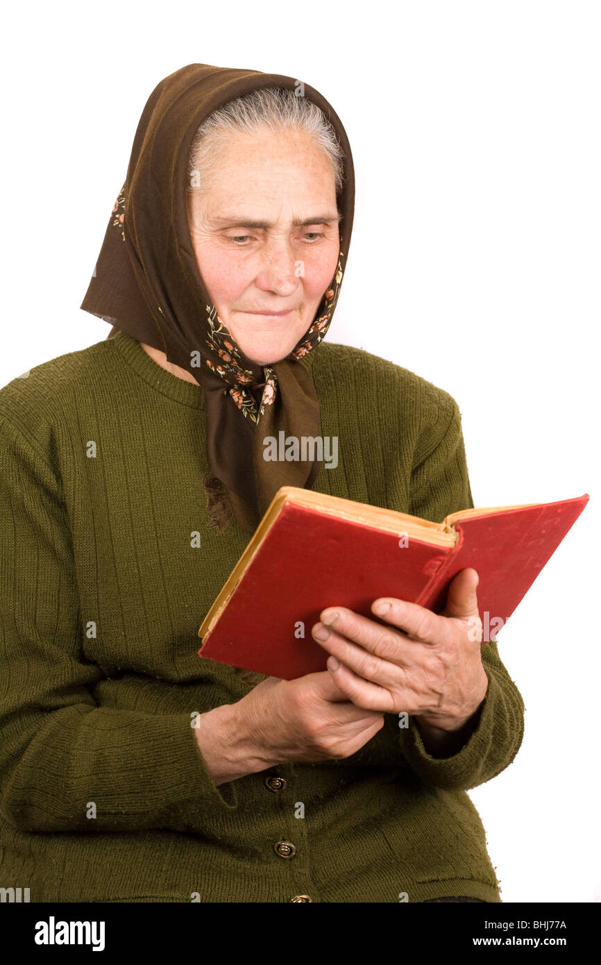 Close-up portrait of an old peasant woman isolated on white background ...