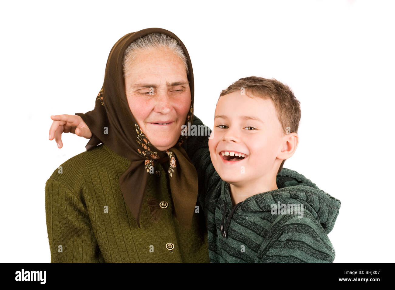 Close-up portrait of an old peasant woman isolated on white background ...