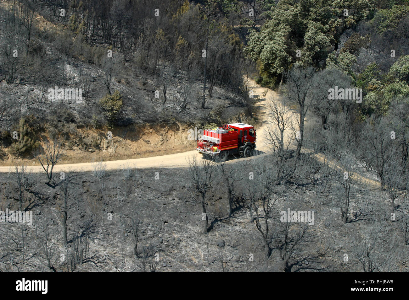 FOREST FIRE TANKER ON A FOREST FIRE PROTECTION TRAIL, FOREST FIRE IN ...