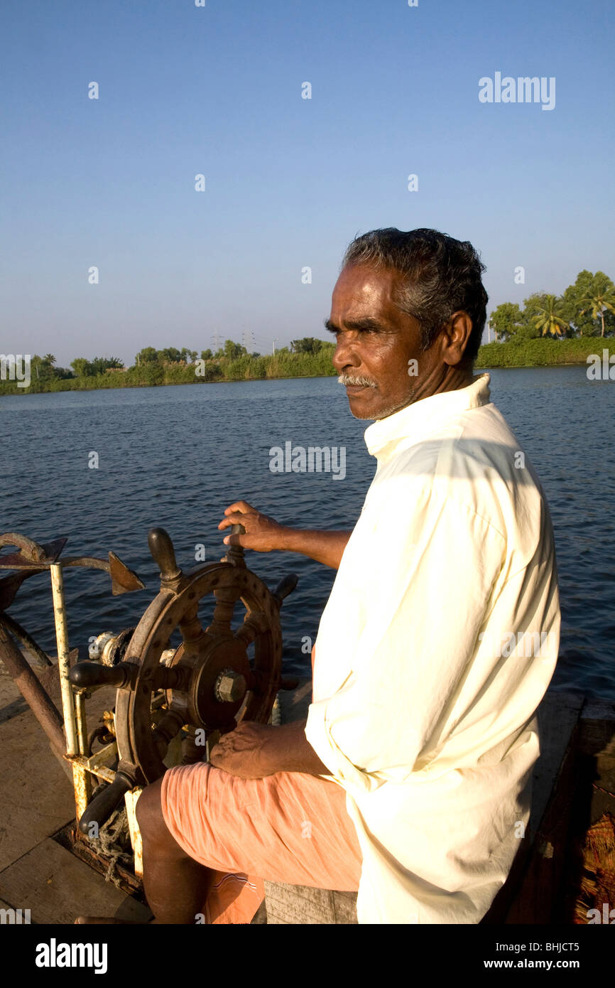Kerala southern india backwater houseboat trip captain Stock Photo - Alamy