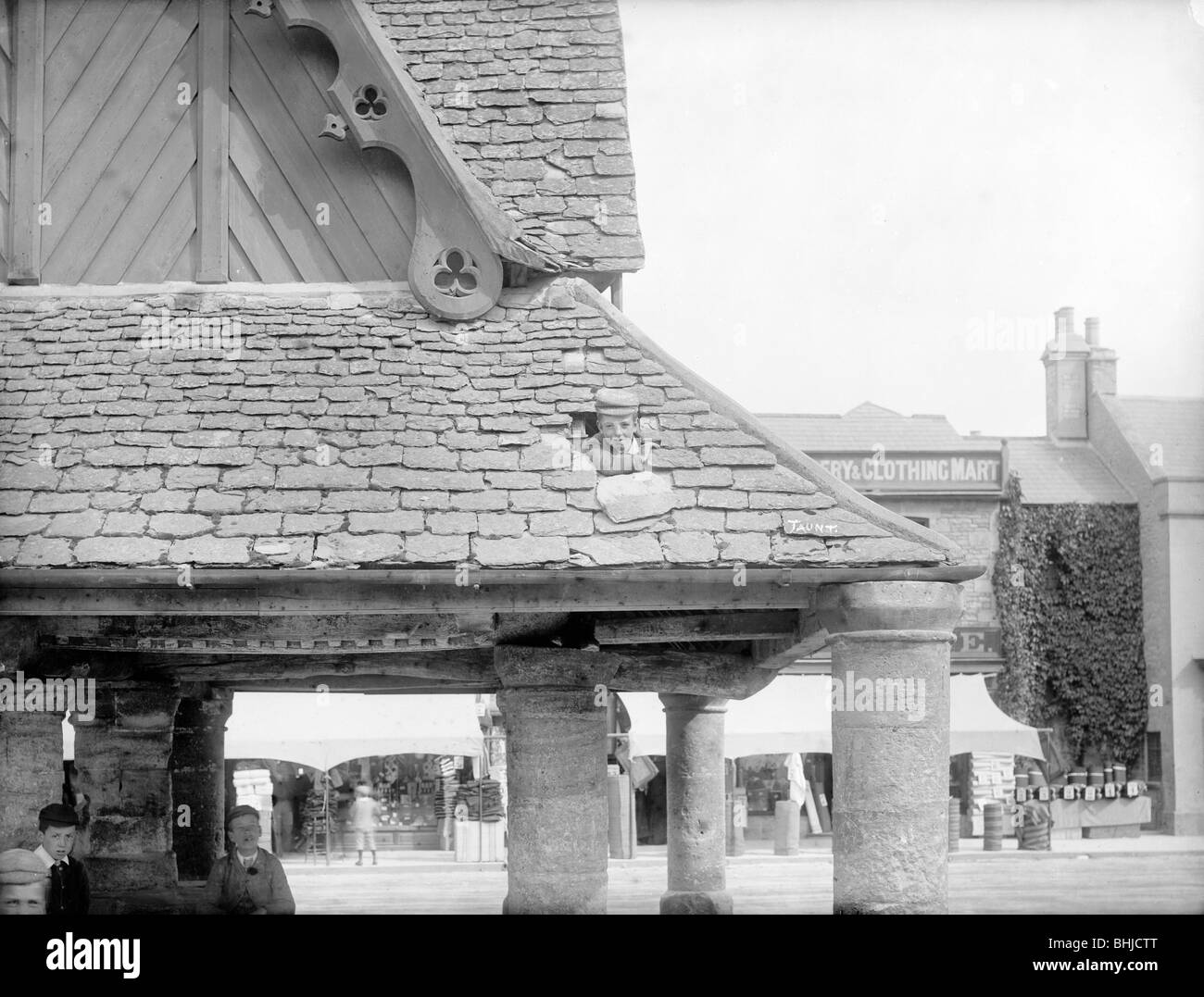 Boy poking his head through the roof of the 17th-century Buttercross ...