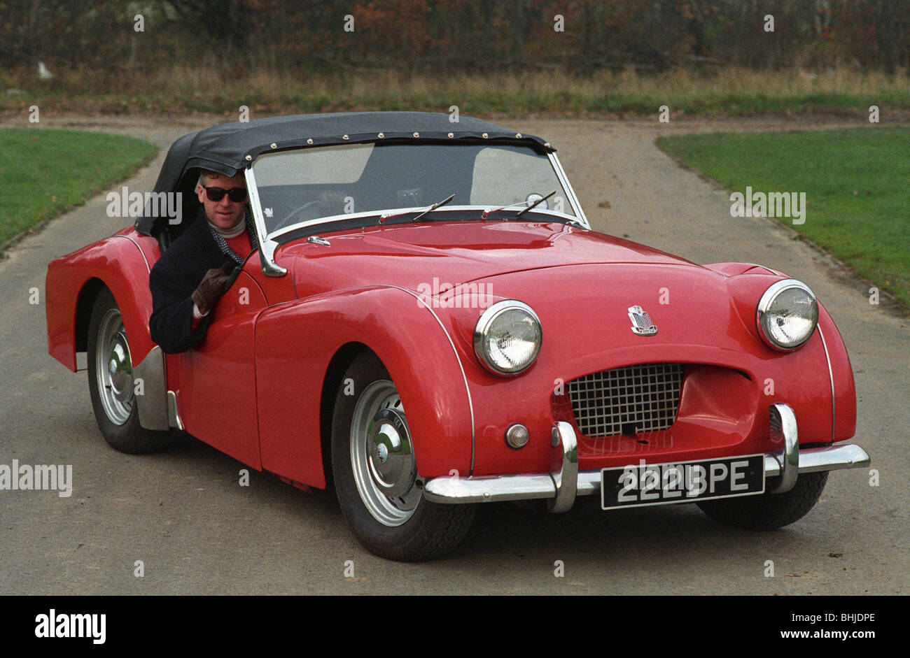 Triumph TR2 red sports car classic british car male driver Stock Photo ...