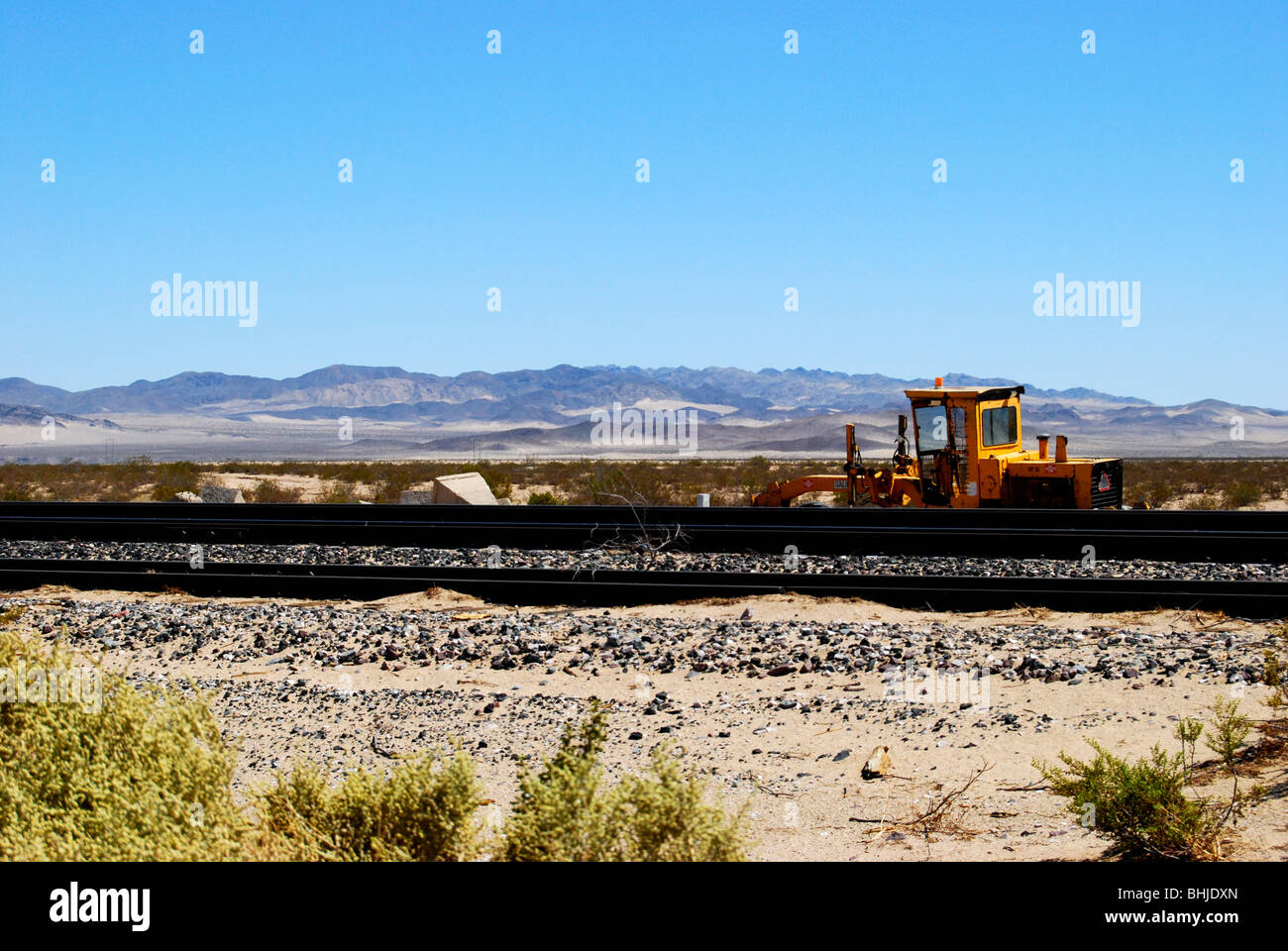 bulldozer along side railroad tracks Stock Photo - Alamy