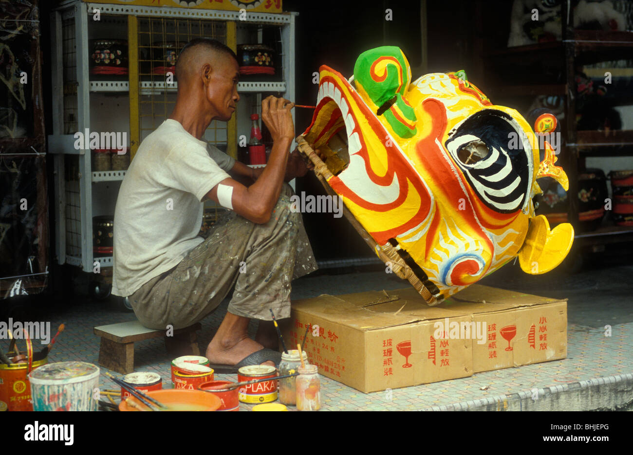 man painting a mask Stock Photo - Alamy