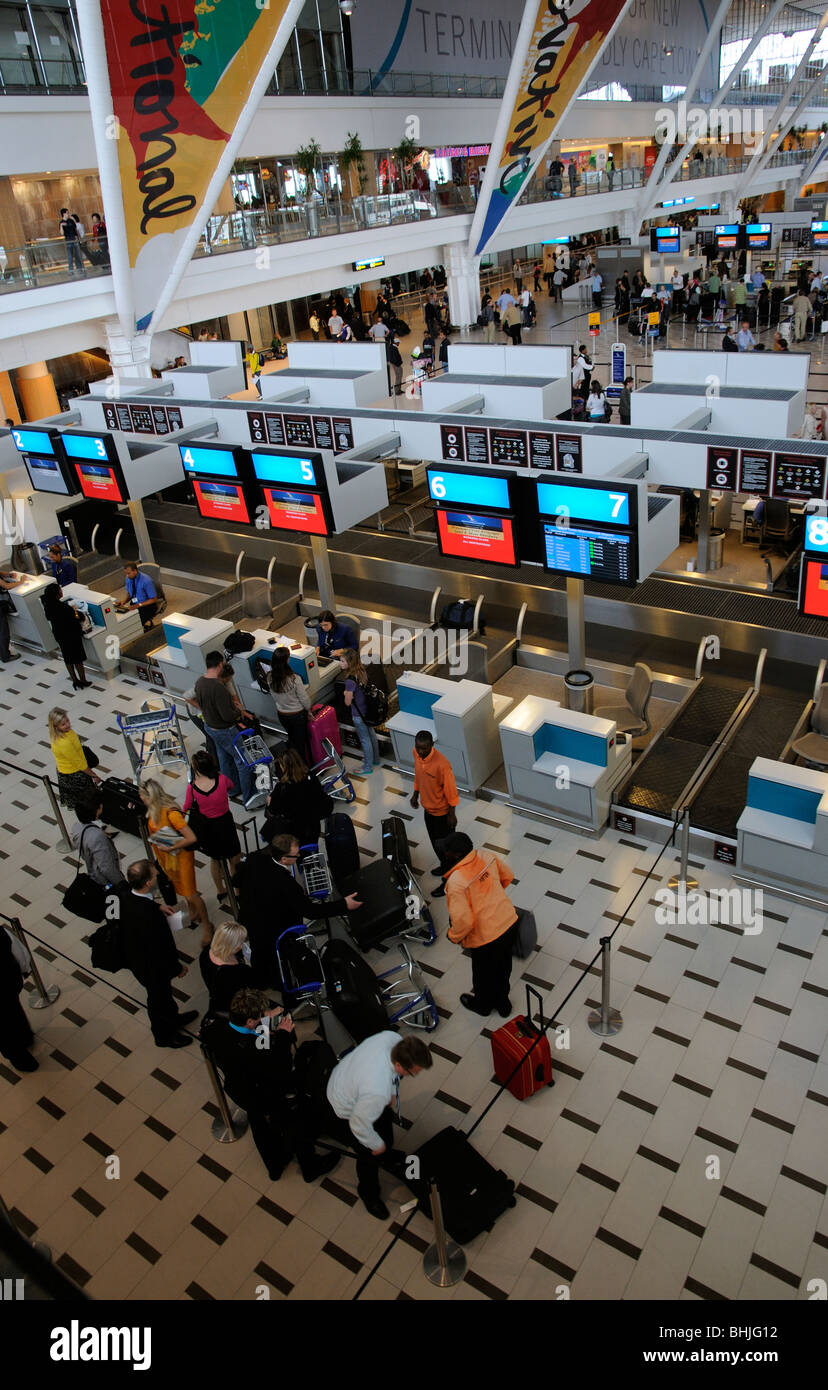 Passengers at check in desks Cape Town International Airport central ...