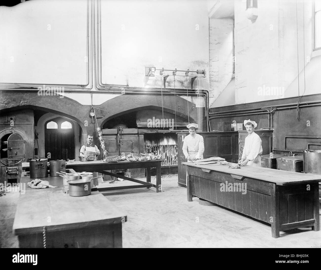 Cooks at work in the kitchens at New College, Oxford, Oxfordshire, 1901 ...