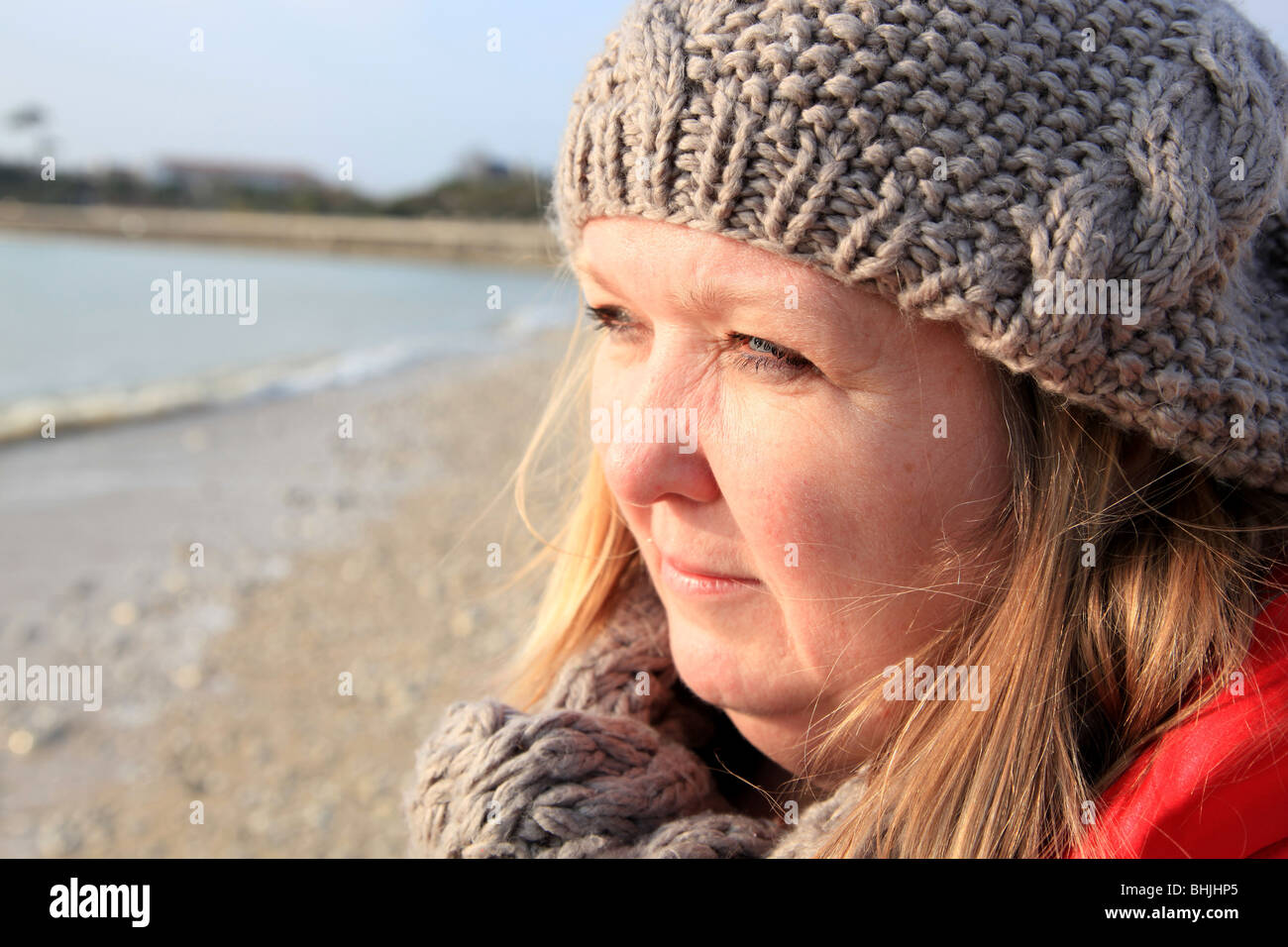 Woman looking sad on beach Stock Photo - Alamy