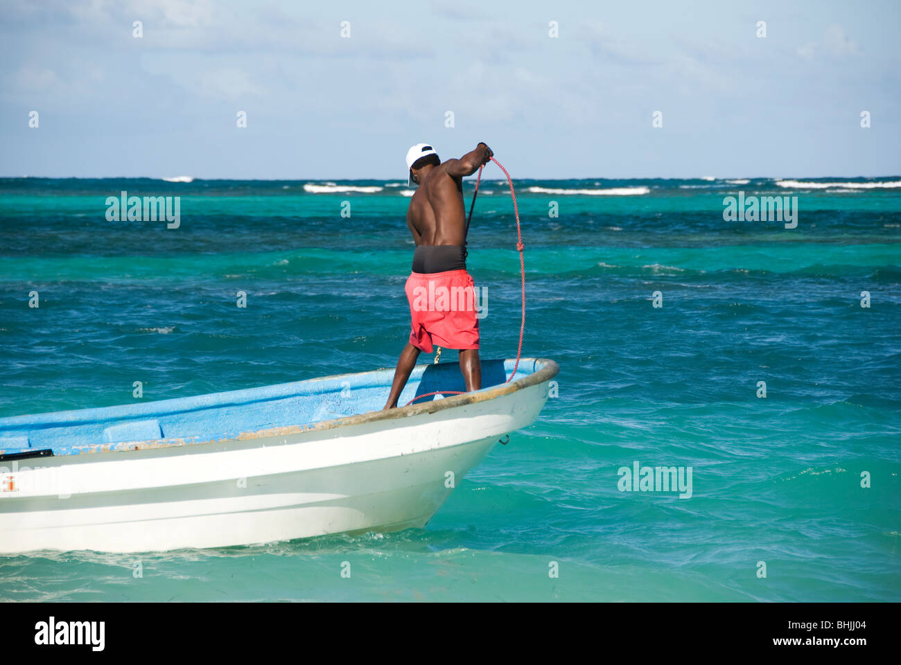 Turquoise sea and boat Stock Photo - Alamy