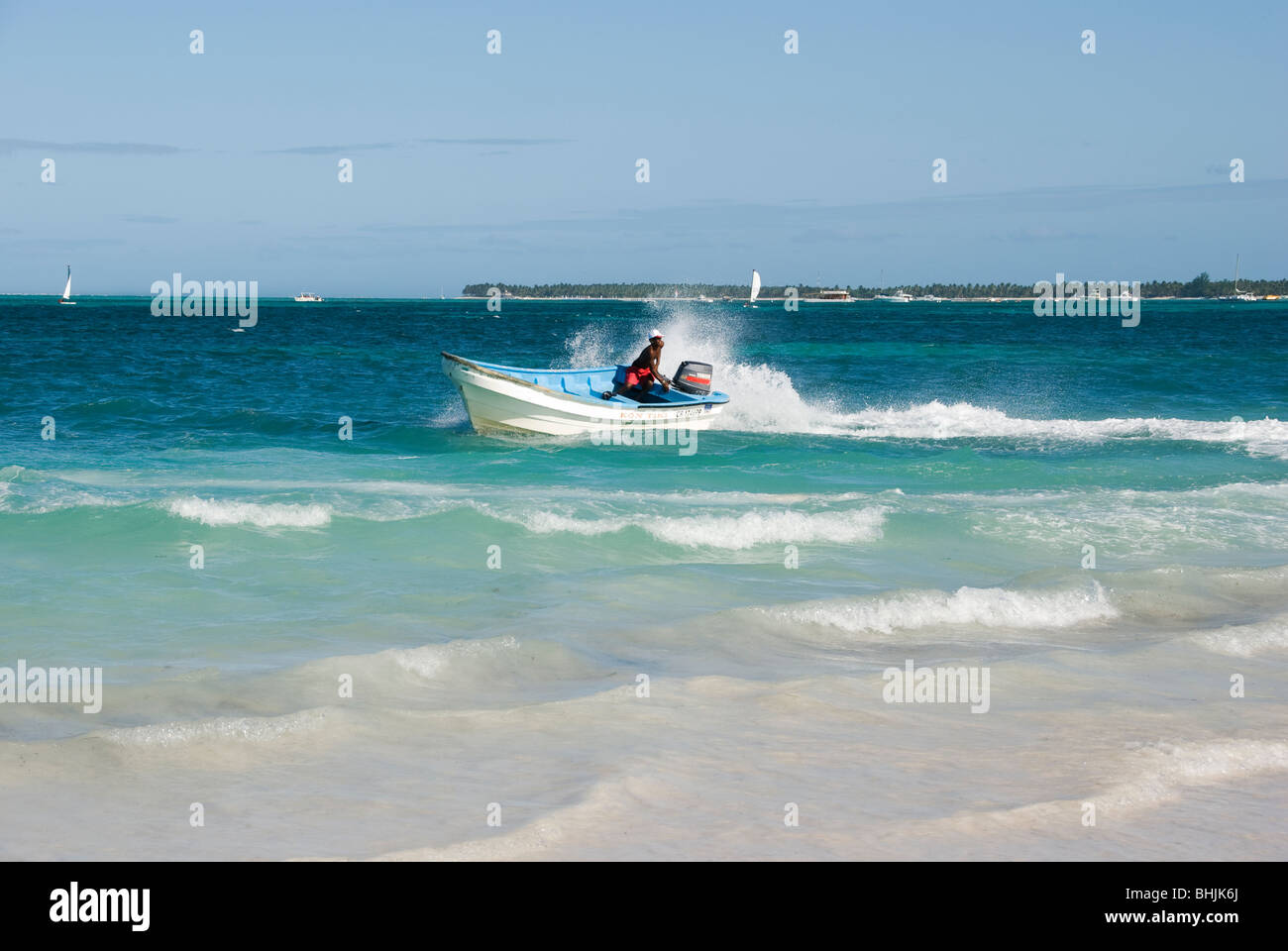 Boat on waves Stock Photo - Alamy