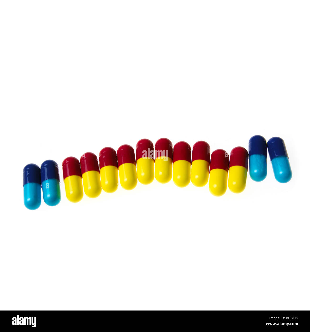 blue, red and yellow flu capsules on a white background Stock Photo - Alamy
