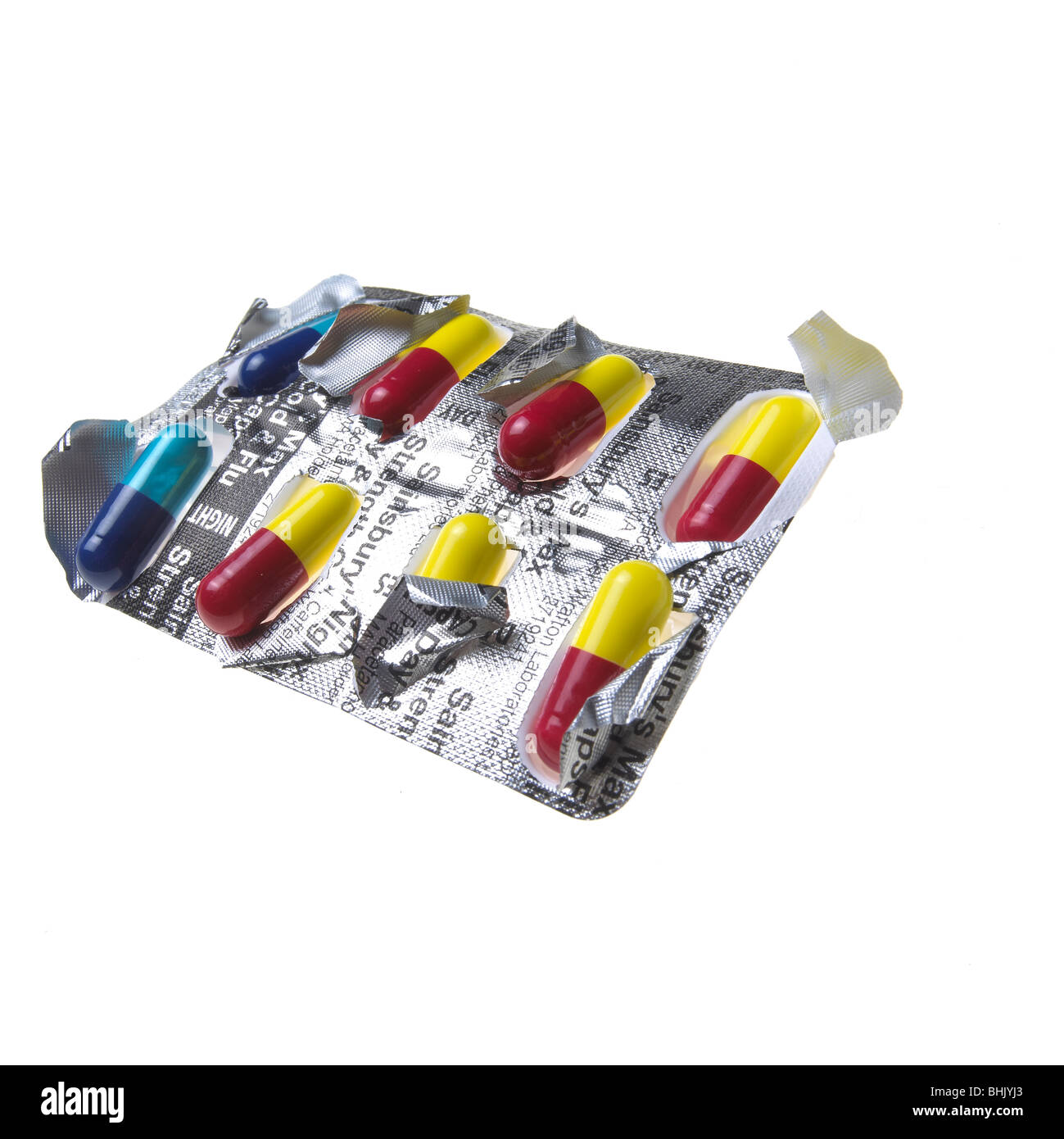 blue, red and yellow flu capsules on a white background Stock Photo - Alamy