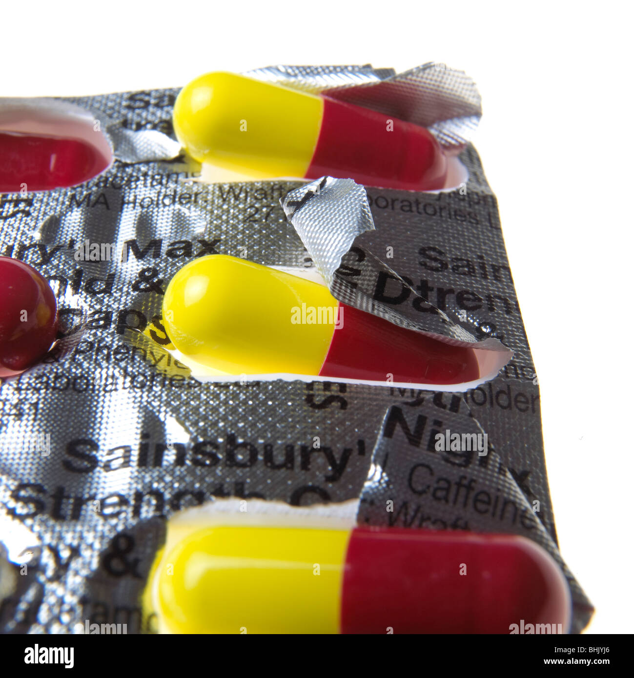 blue, red and yellow flu capsules on a white background Stock Photo - Alamy