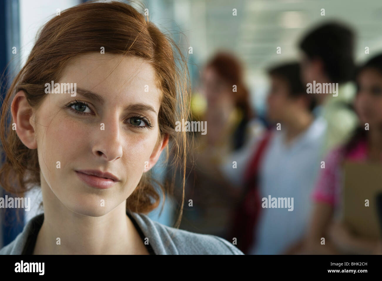 Female high school student, classmates in background Stock Photo - Alamy